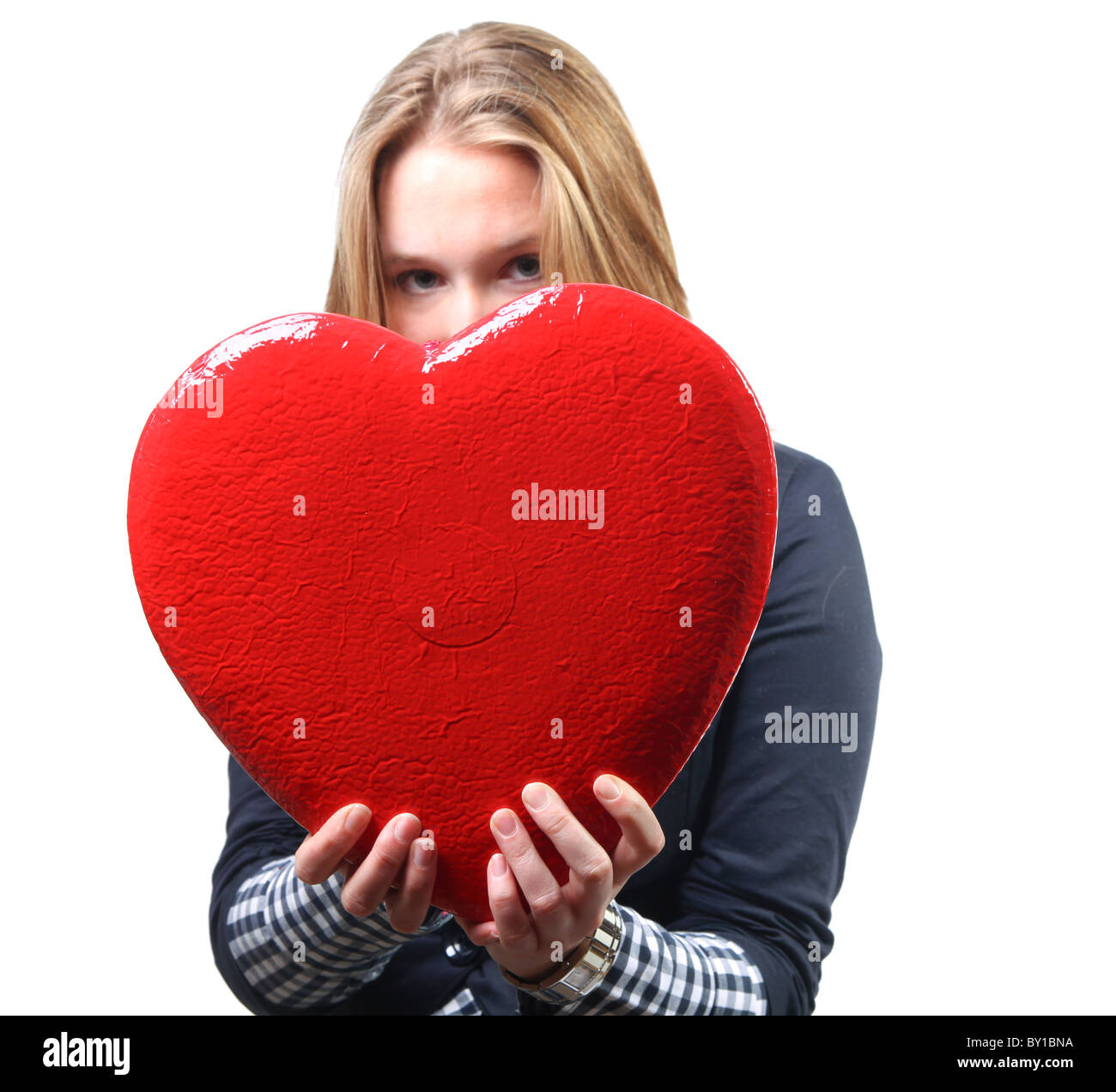 Pretty young woman giving a valentine's heart Stock Photo - Alamy