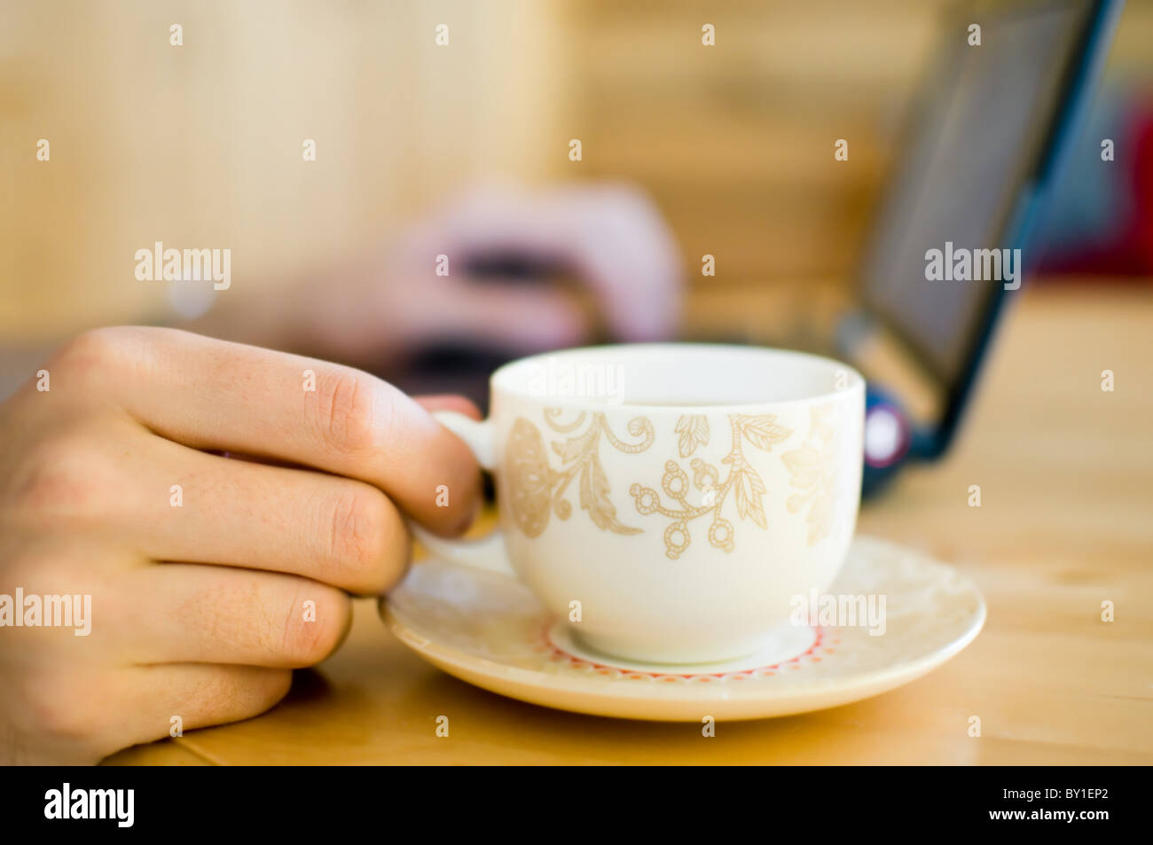 Hand with cup of coffee Stock Photo - Alamy