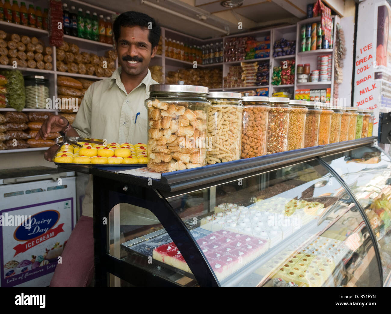 A stall in Mysore selling freshly made Indian sweets and deserts Stock ...
