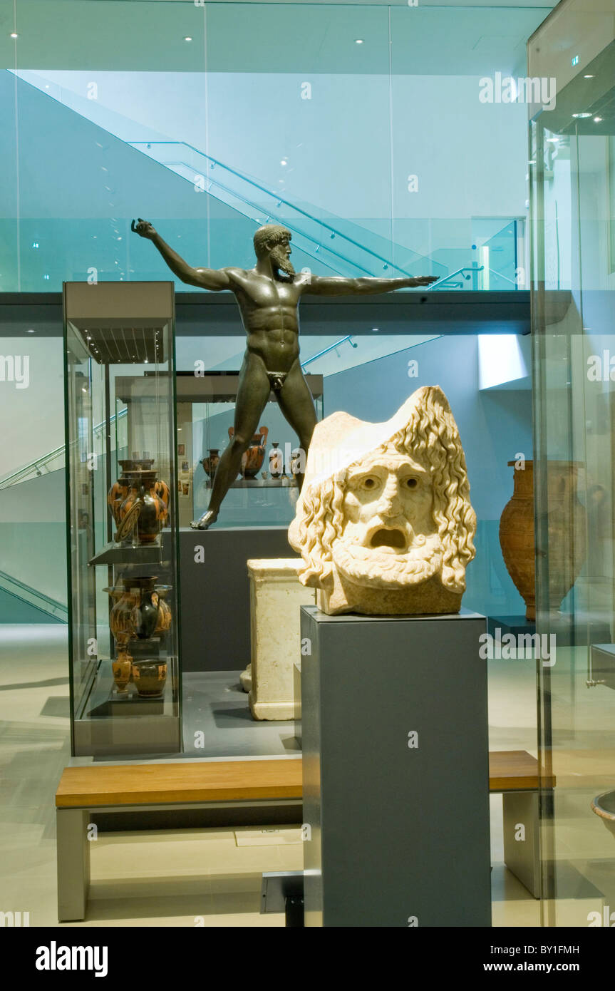 Exhibits from Near East. Large standing statue is a Bronze cast of a ...