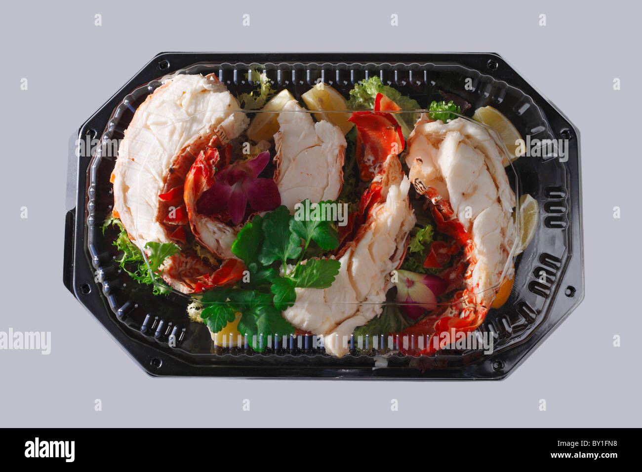Prepared lobster tail in plastic box Stock Photo - Alamy