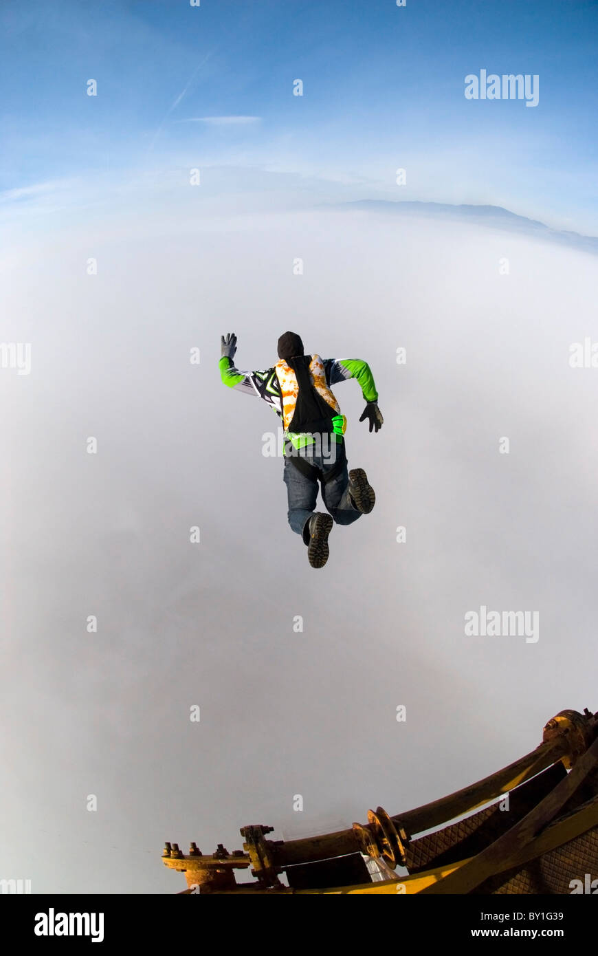 A man BASE jumping from a radio antenna Stock Photo - Alamy