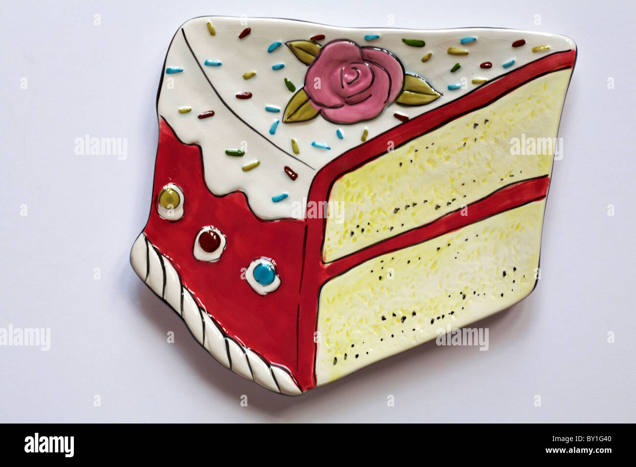 Pretty cake shaped plate isolated on white background Stock Photo - Alamy