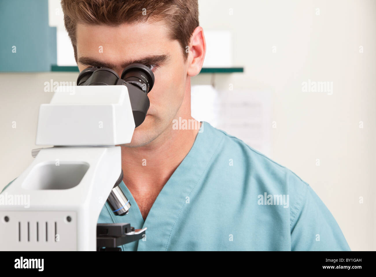 Person viewing through microscope hi-res stock photography and images ...