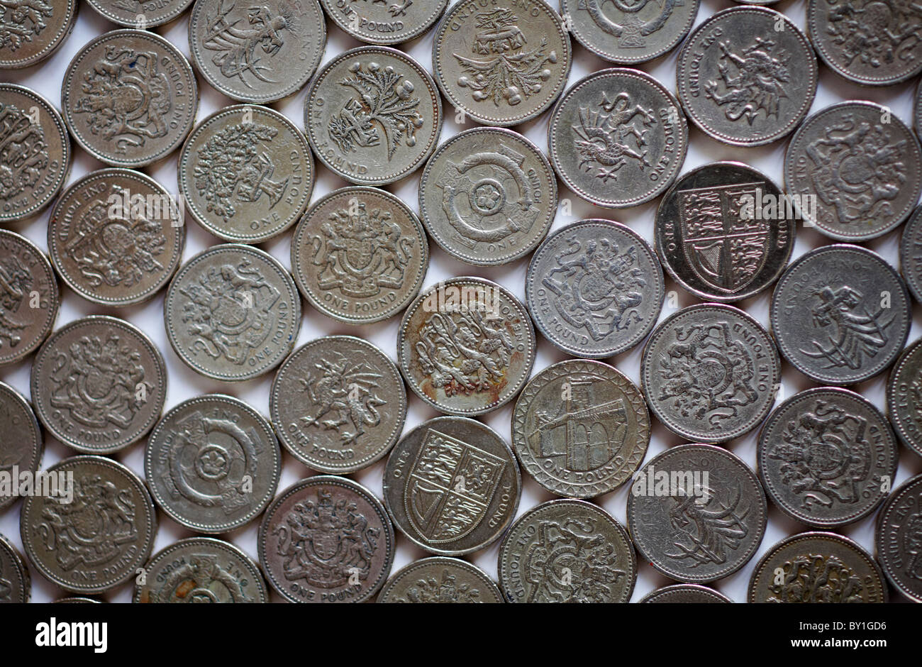 A spread of assorted £1 coins Stock Photo - Alamy