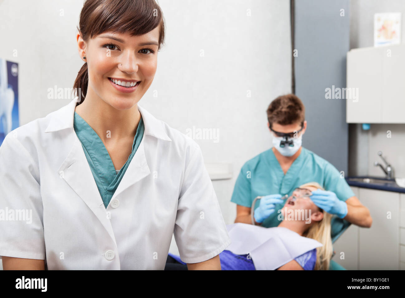 Portrait of dental assistant smiling with dentistry work in the ...