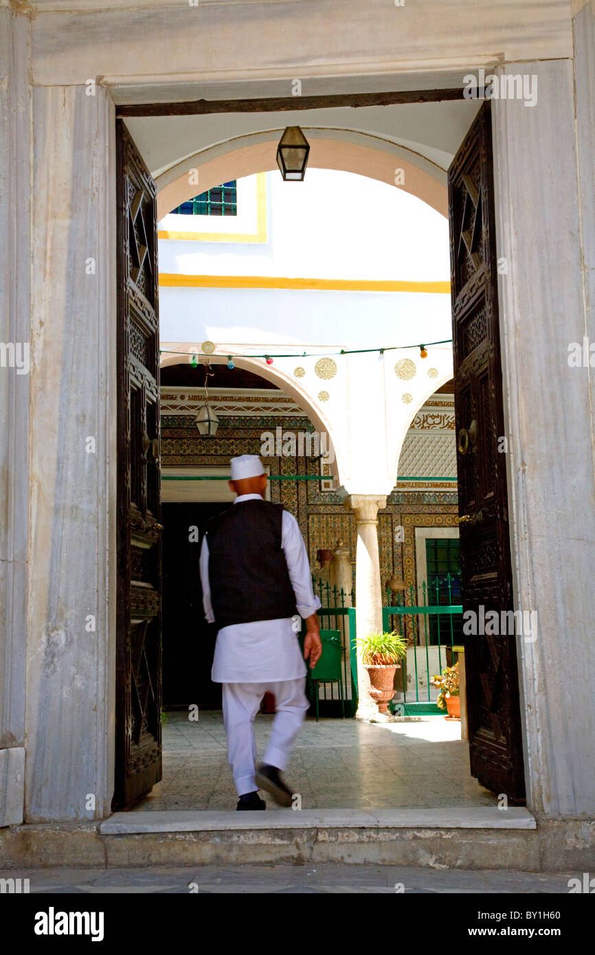 Tripoli, Libya; A Libyan man in traditional clothes enters through the ...