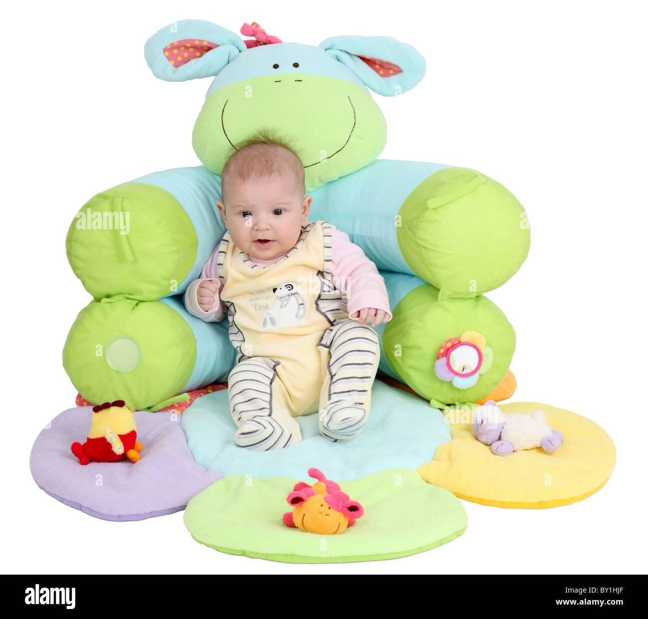 Baby in a colorful child seat Stock Photo - Alamy