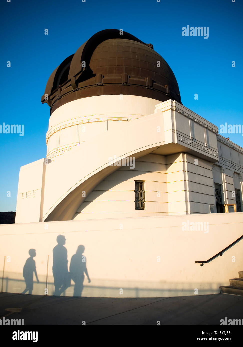 Silhouette of a family walking in front of the west observation deck at ...