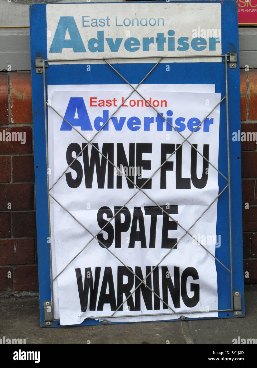 Newspaper placard for East End Advertiser with headline Swine flu spate ...