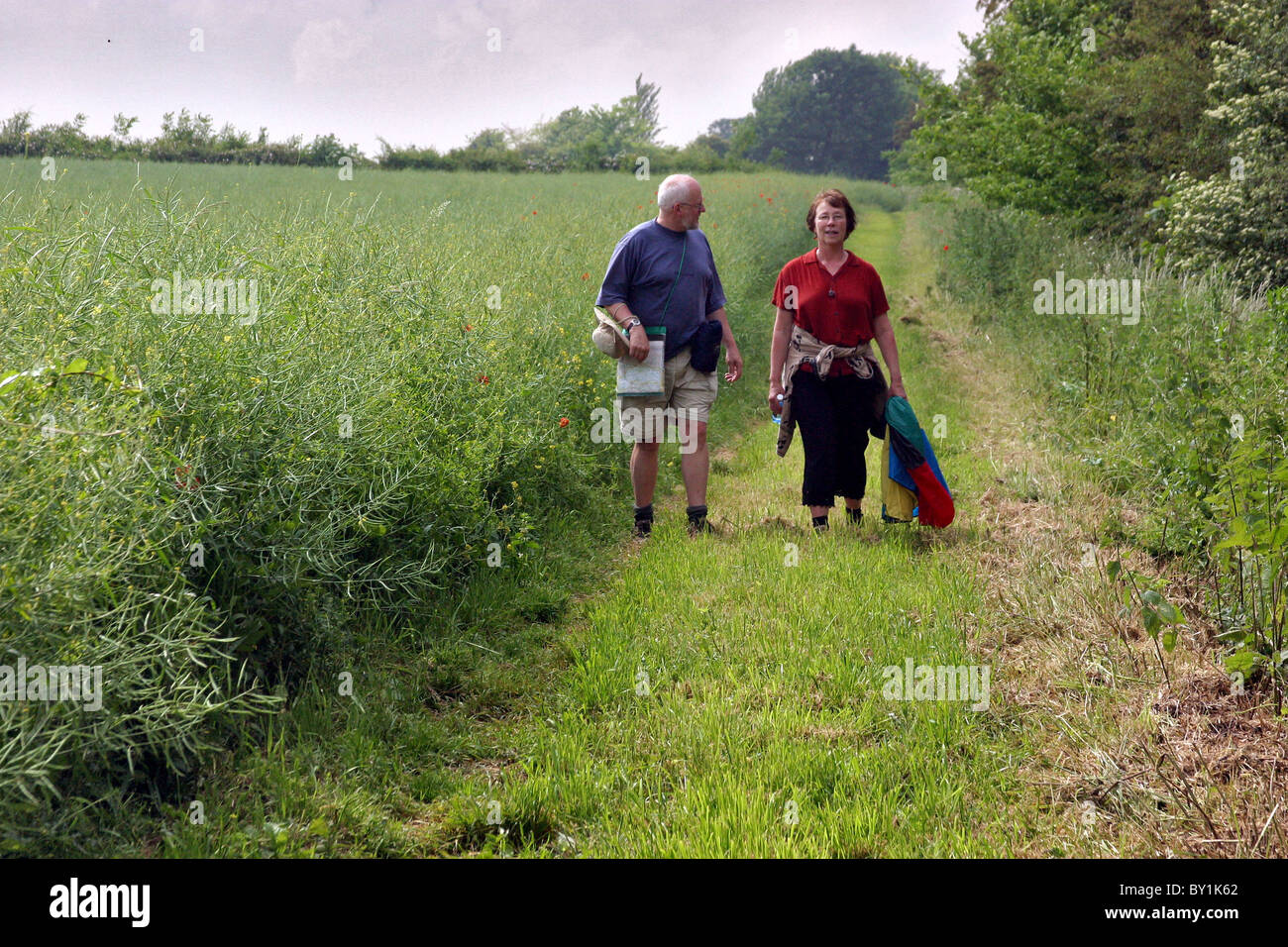 Old couple walking in the countryside Stock Photo - Alamy
