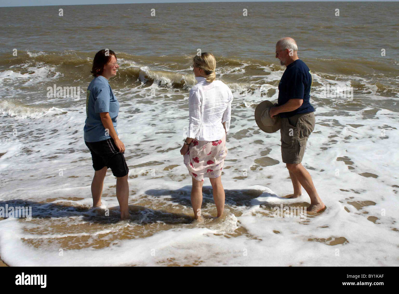 people wading in the sea Stock Photo - Alamy