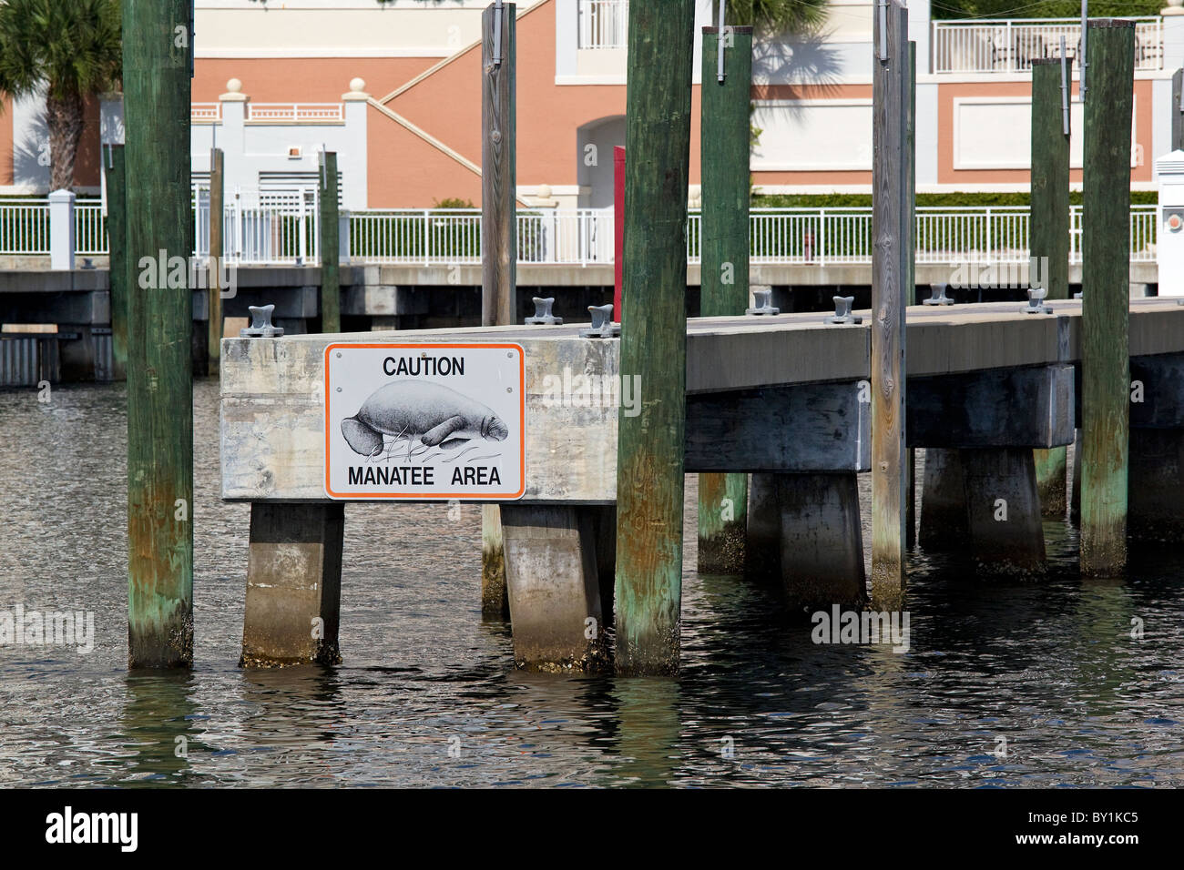 Caution Manatee Area sign on end of pier in waterway, West Palm Beach ...