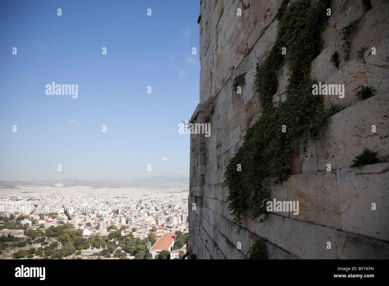 The ancient wall in Acropolis against the cityscape of Athens Stock ...