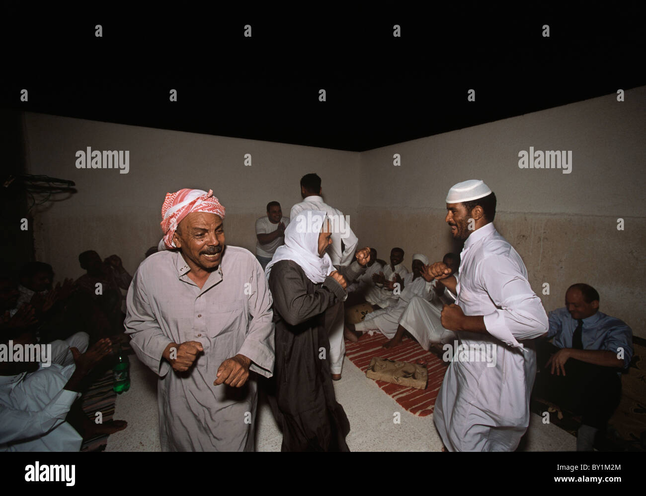 Bedouins dance at traditional wedding celebration at groom's home. El ...