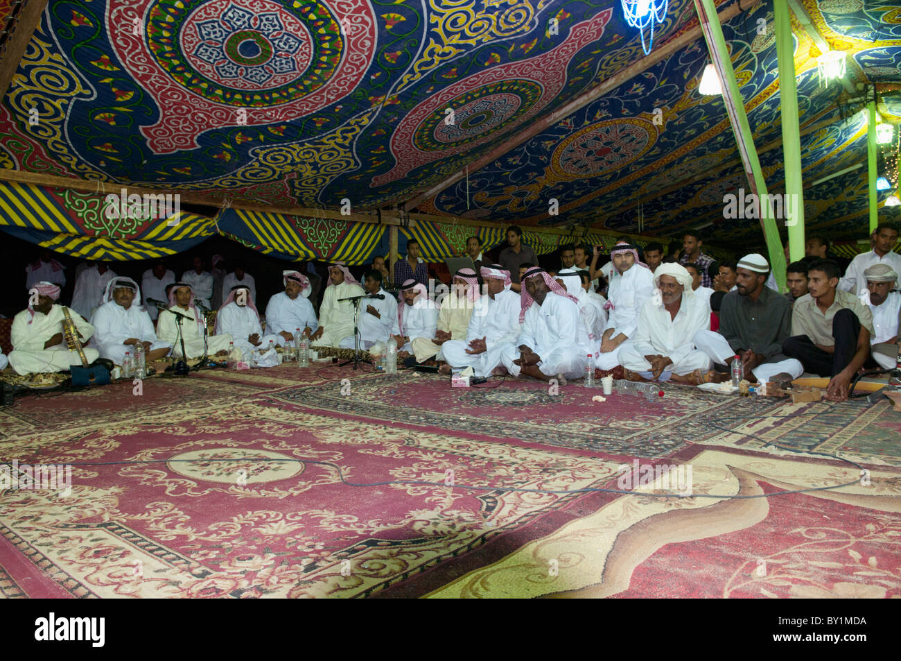 Seated guests await entertainment during a traditional Bedouin wedding ...