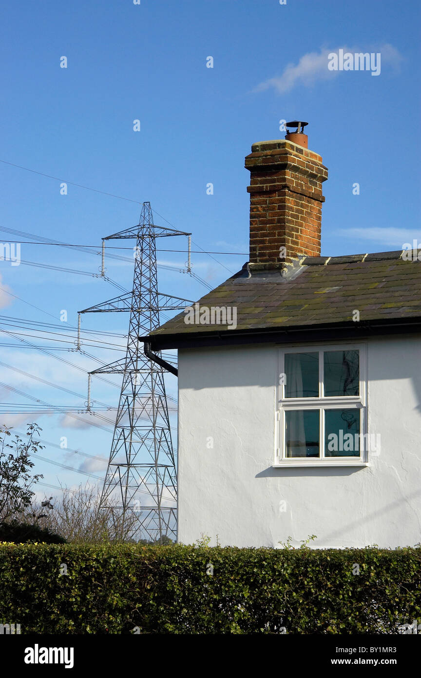 Cottage with Electric pylon England Stock Photo - Alamy