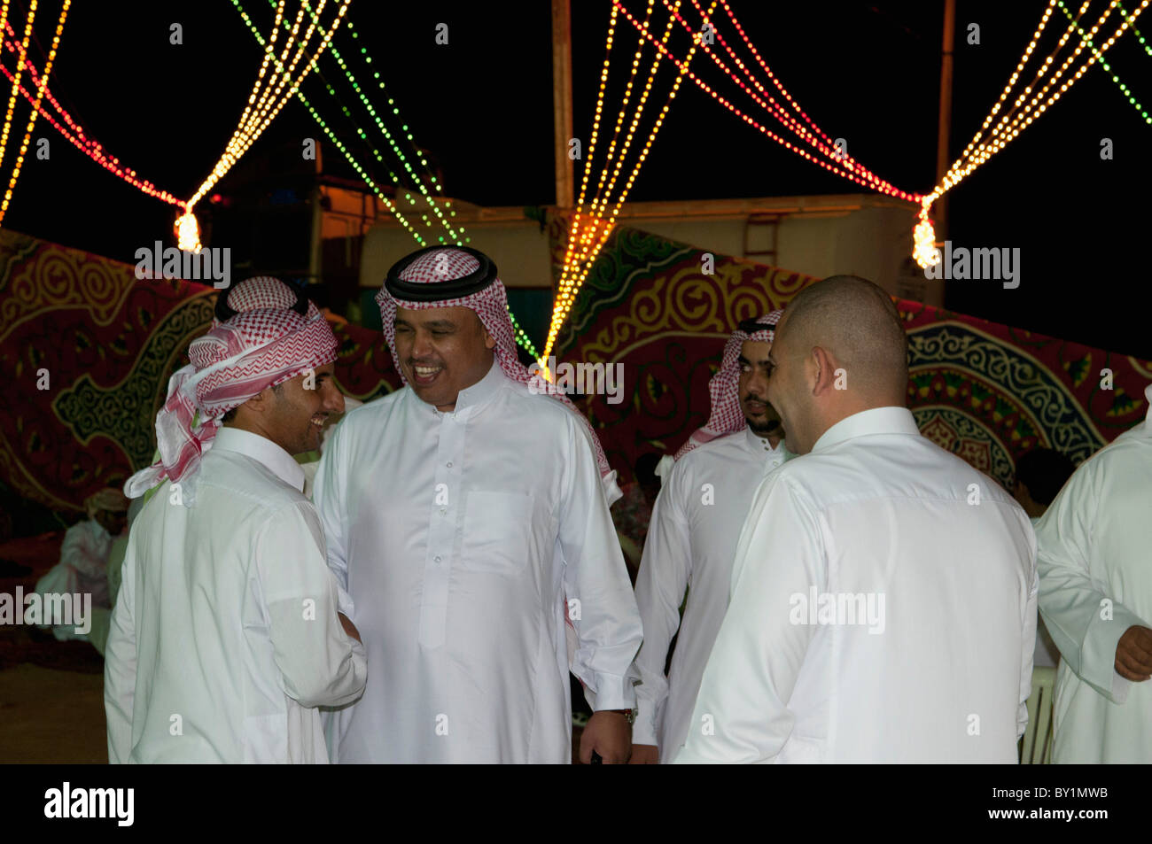Guests greet one another during a traditional Bedouin wedding ...