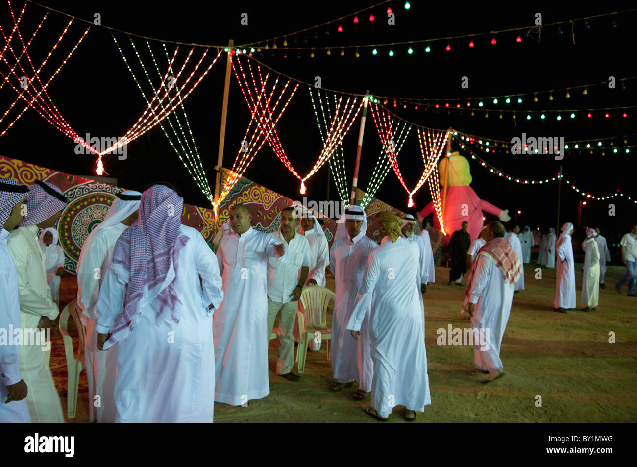 Guests greet one another during a traditional Bedouin wedding ...