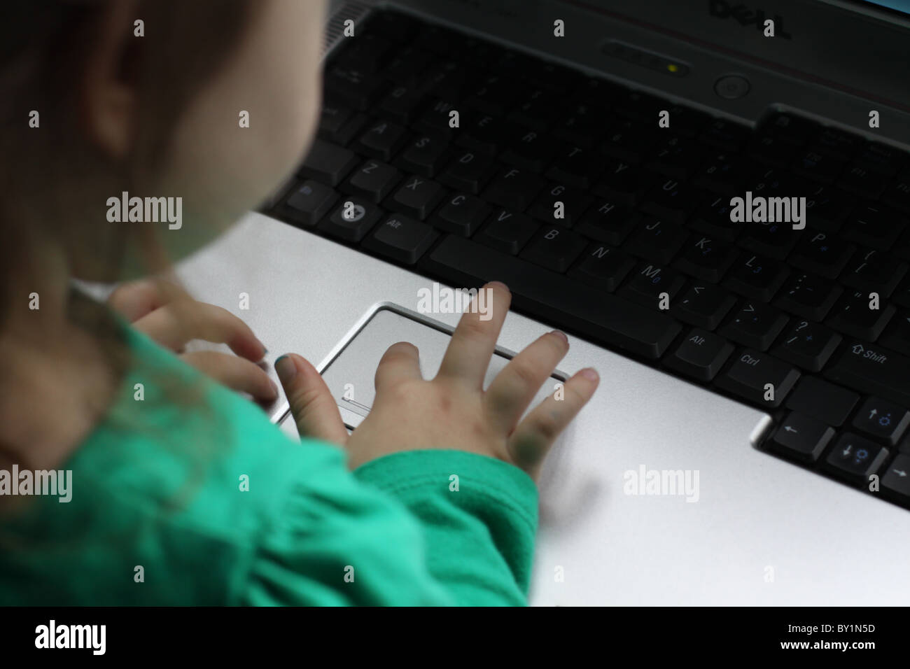 A small child using a laptop computer Stock Photo - Alamy