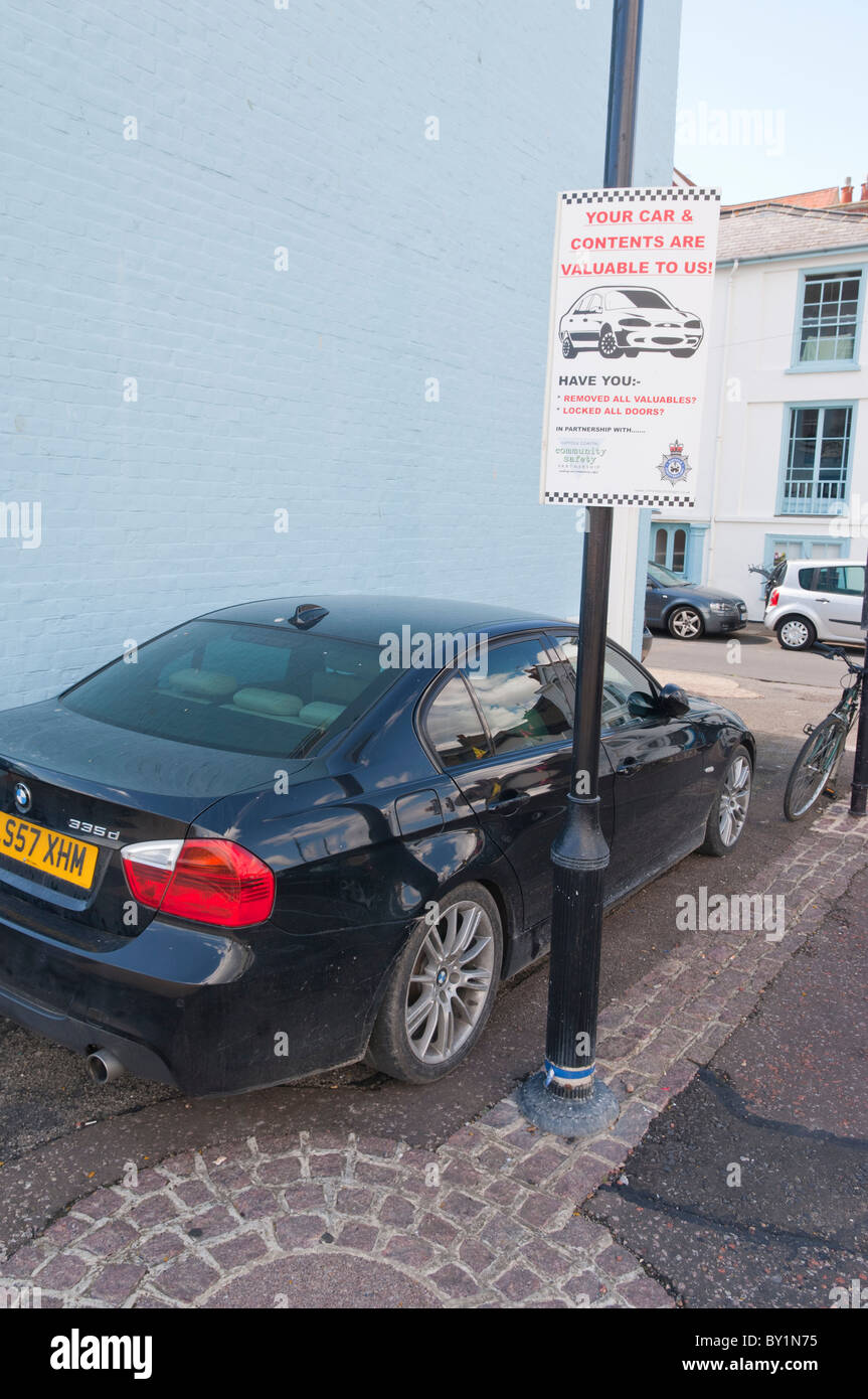 A sign warning of vehicle theft in a car park at Aldeburgh , Suffolk ...