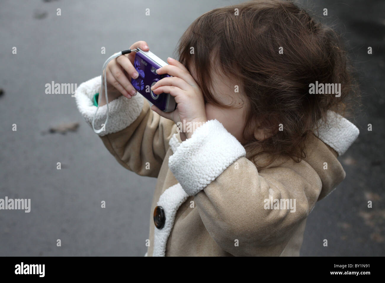 A small child taking a picture with a digital snapshot camera Stock ...