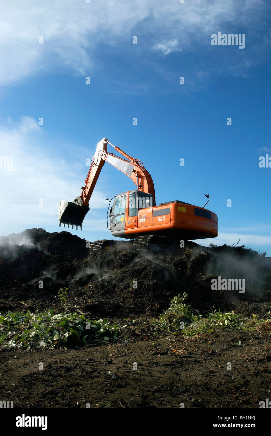 Tracked excavator on landfill Stock Photo - Alamy