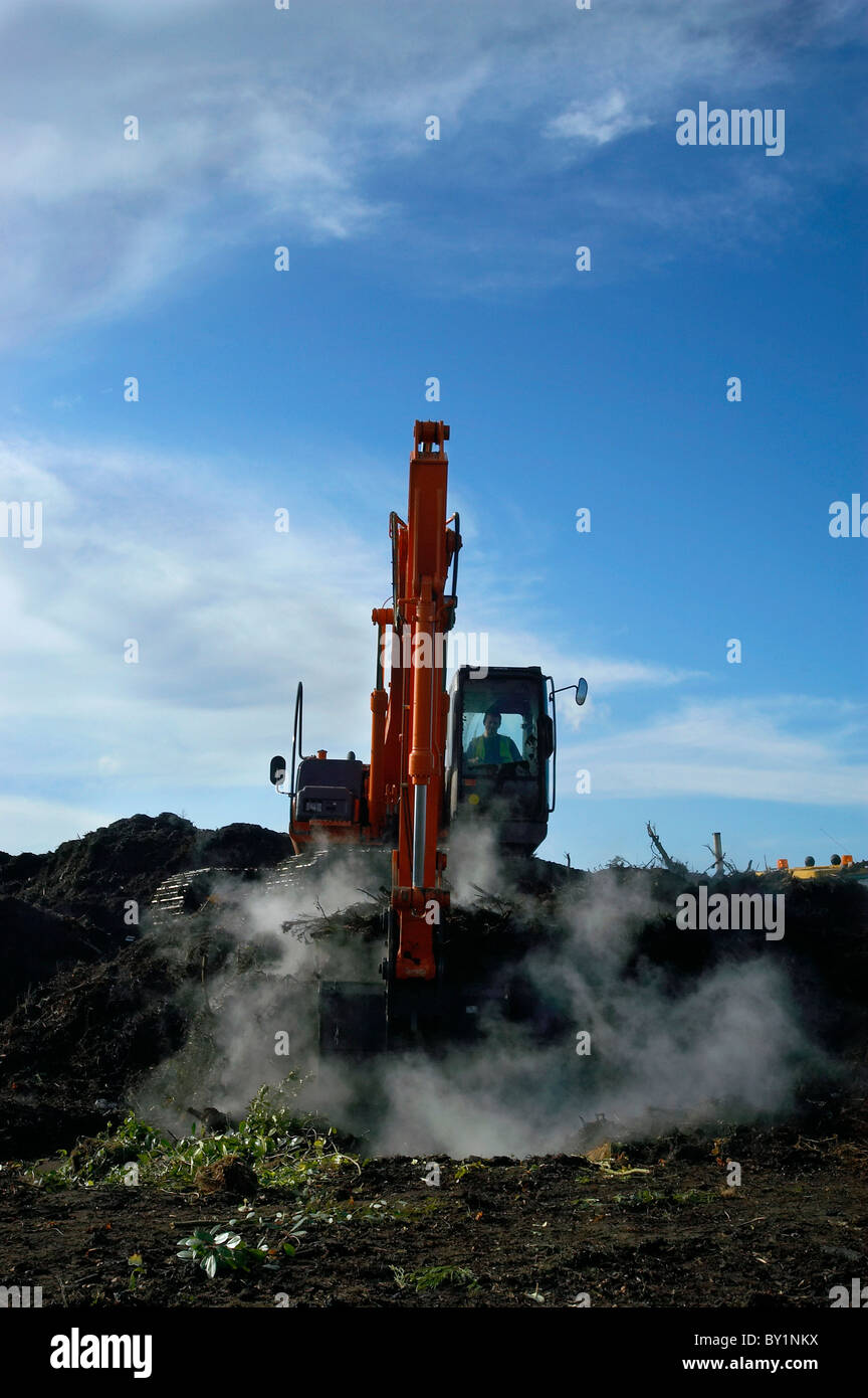 Tracked excavator on landfill Stock Photo - Alamy