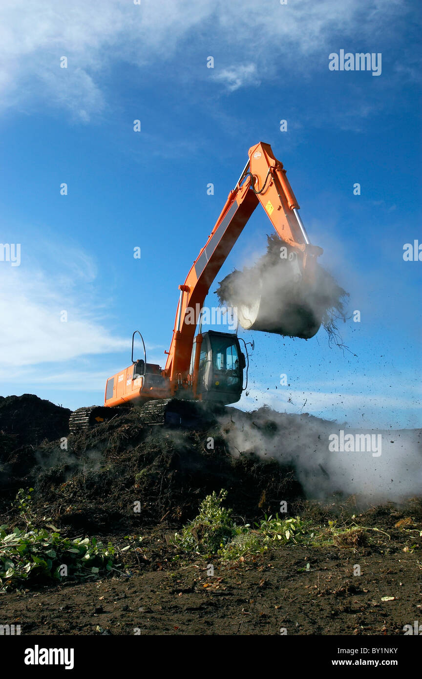 Tracked excavator on landfill Stock Photo - Alamy
