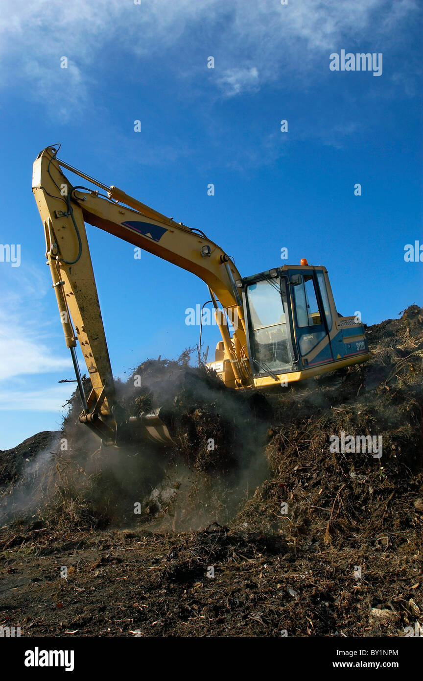 Tracked excavator on landfill Stock Photo - Alamy