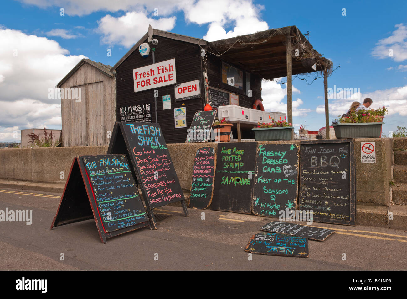 Signs outside a fish stall in the summer at Aldeburgh , Suffolk ...