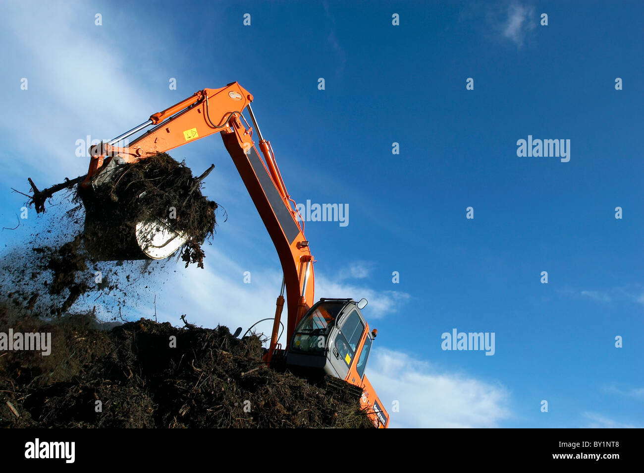 Tracked excavator on landfill Stock Photo - Alamy