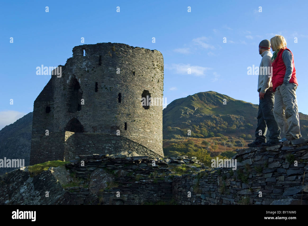 UK; North Wales; Snowdonia; Couple sightseeing at Dolbadarn Castle ...