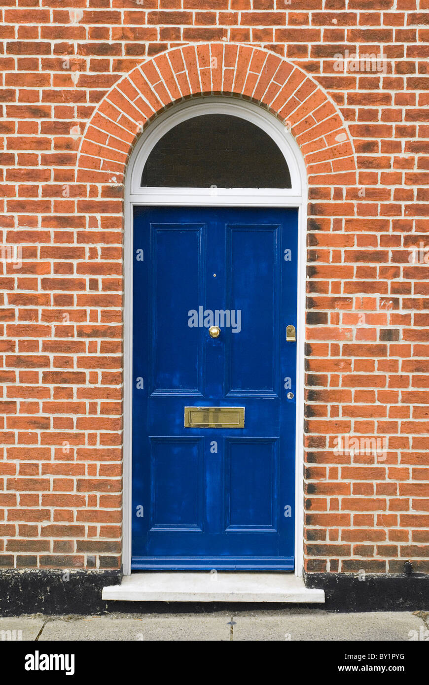 Front door set in new brickwork Stock Photo - Alamy