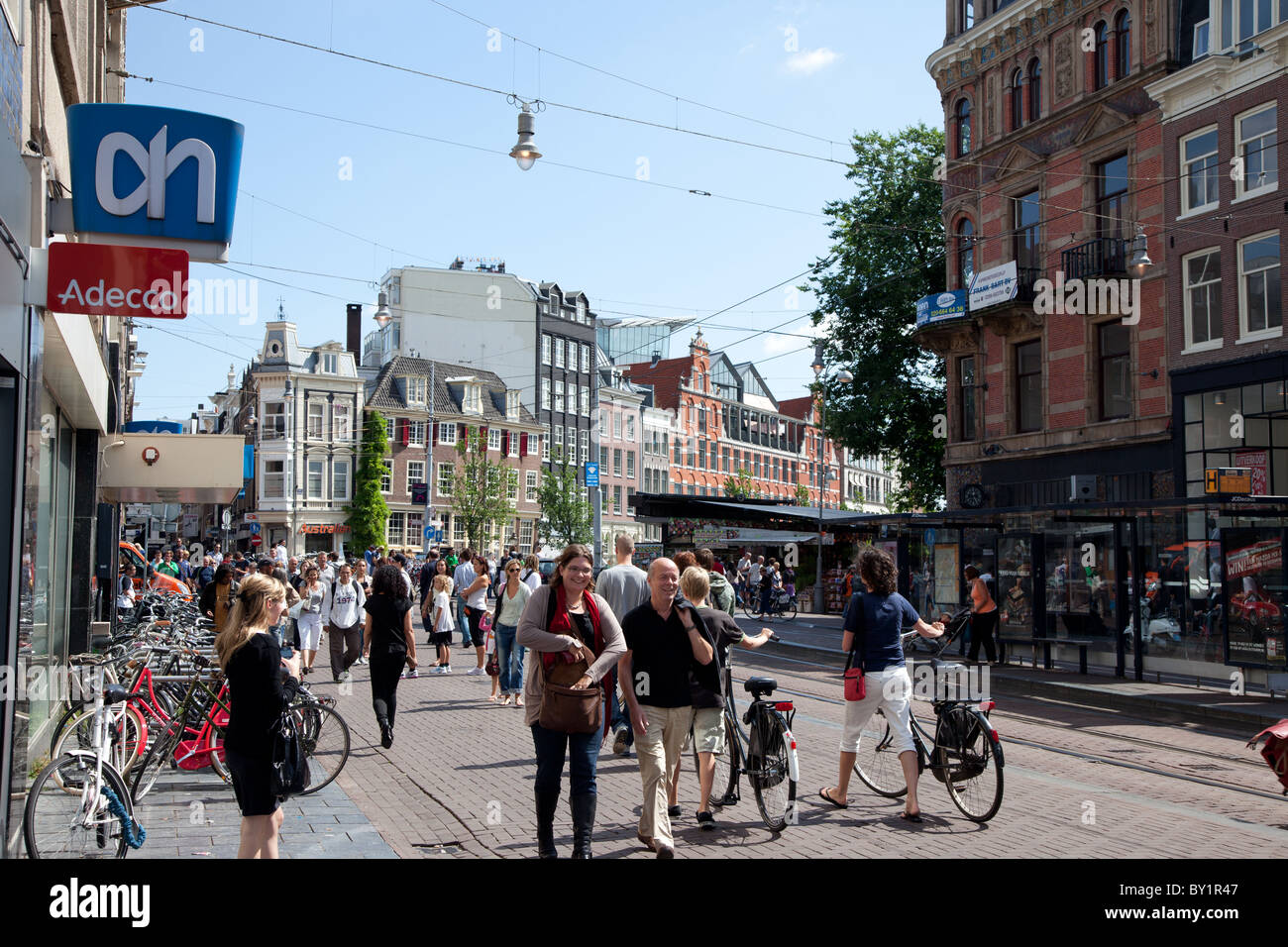 Busy street in Amsterdam in the Summer Stock Photo - Alamy