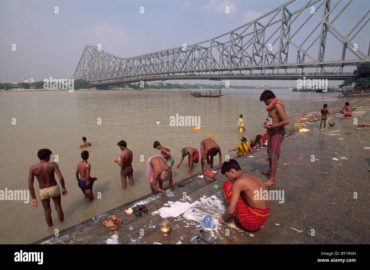 Bathing at Babu Ghat inthe Hoogly River (Ganges), Howrah Bridge in ...
