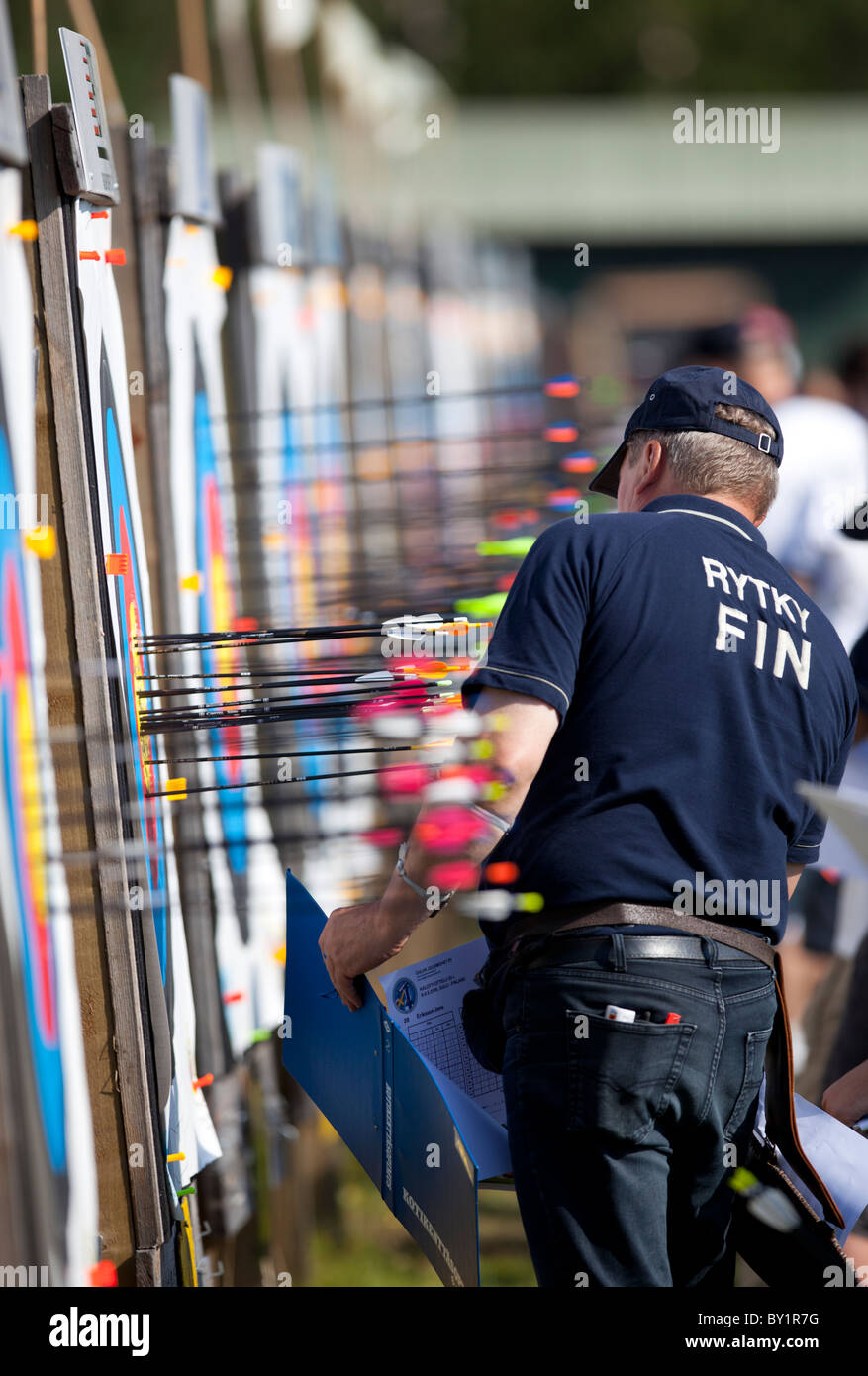 Standard FITA archery target and arrows shot to it , competitor ...