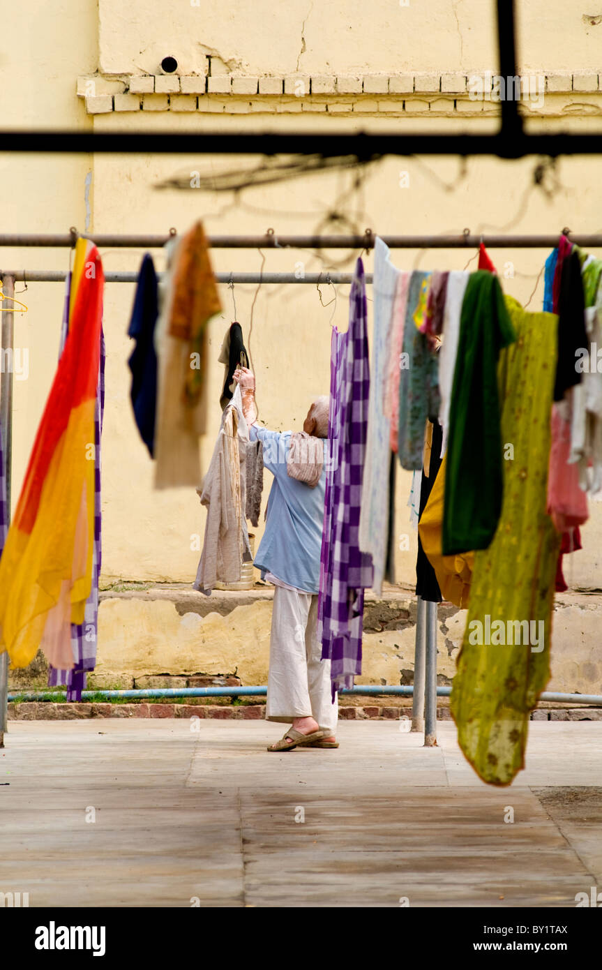Indian man washing clothes in hi-res stock photography and images - Alamy