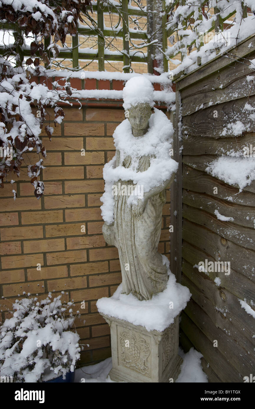 A Statue with snow designed dress and hat, England Stock Photo - Alamy