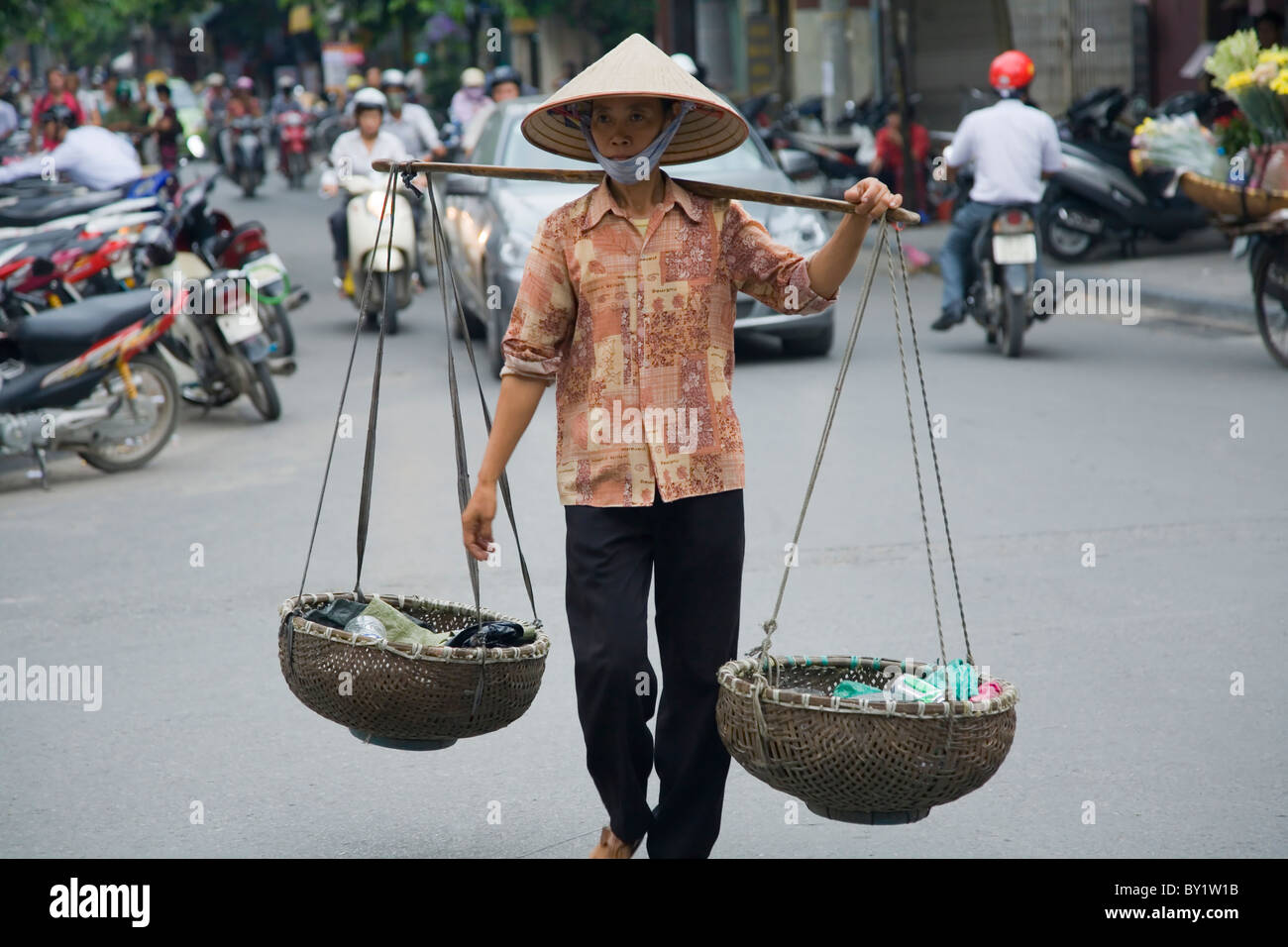 hawker in a street. Hanoi, Vietnam Stock Photo - Alamy