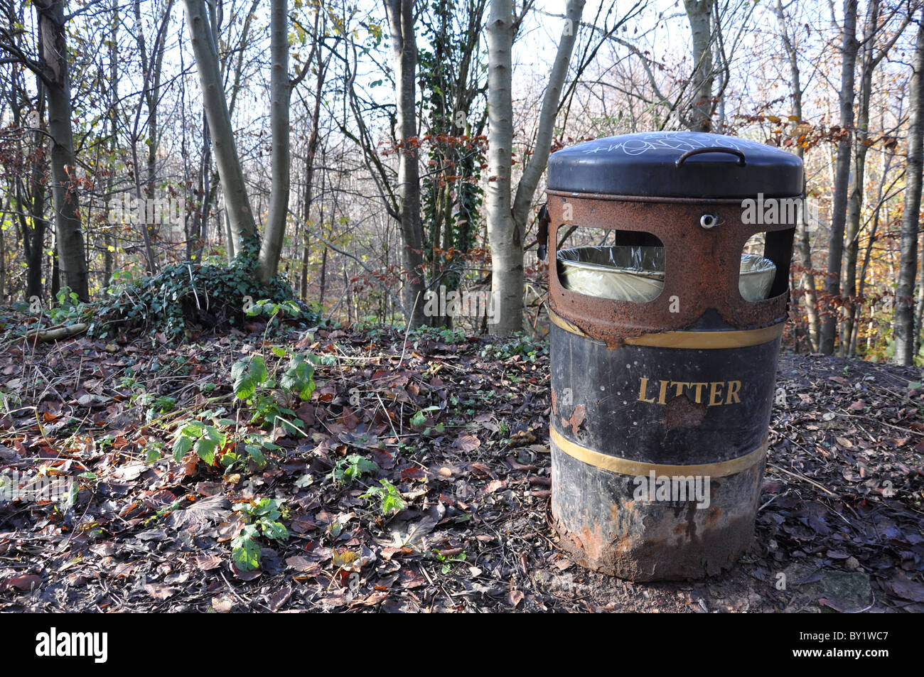 Rusty litter bin set in a woodland walk along the Skyline walk in Bath ...