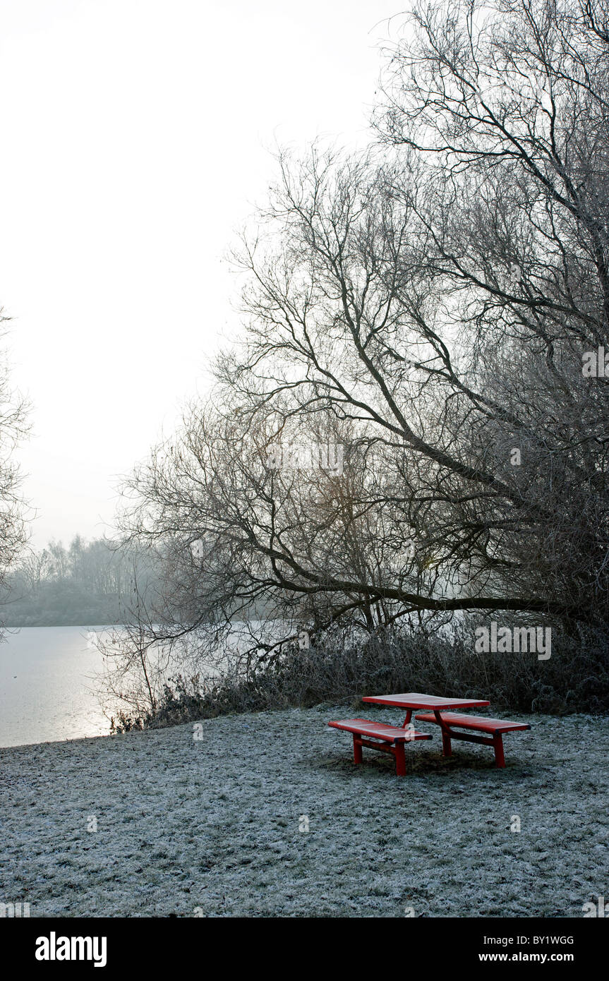 winter scene with red bench Stock Photo - Alamy