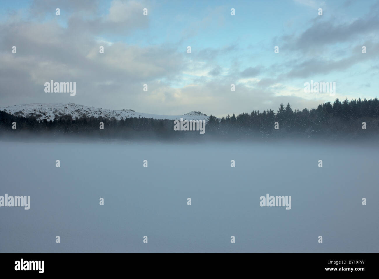 Freezing fog over a frozen Burrator reservoir on Dartmoor Devon UK ...