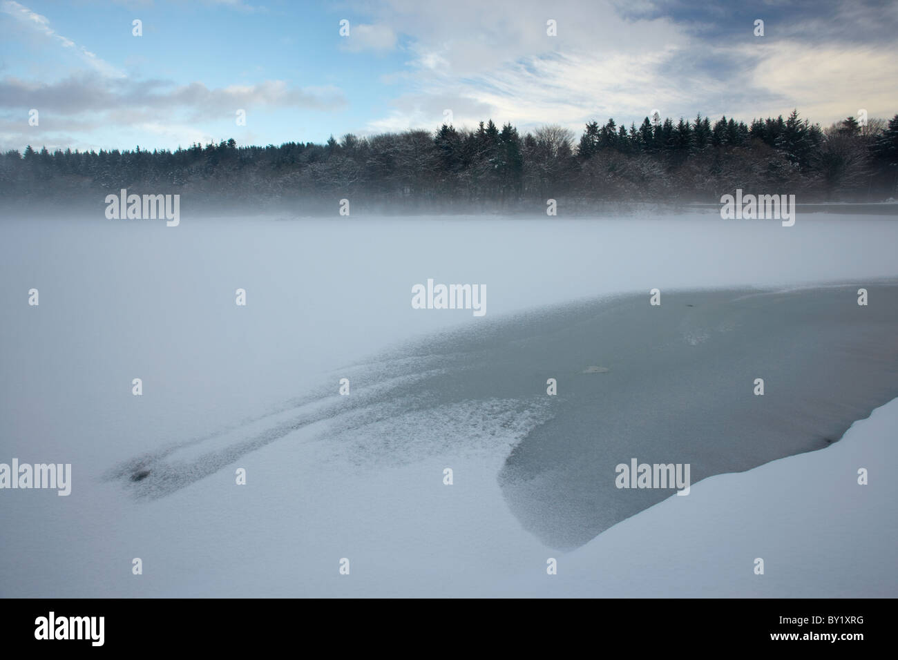 Freezing fog over a frozen Burrator reservoir on Dartmoor Devon UK ...