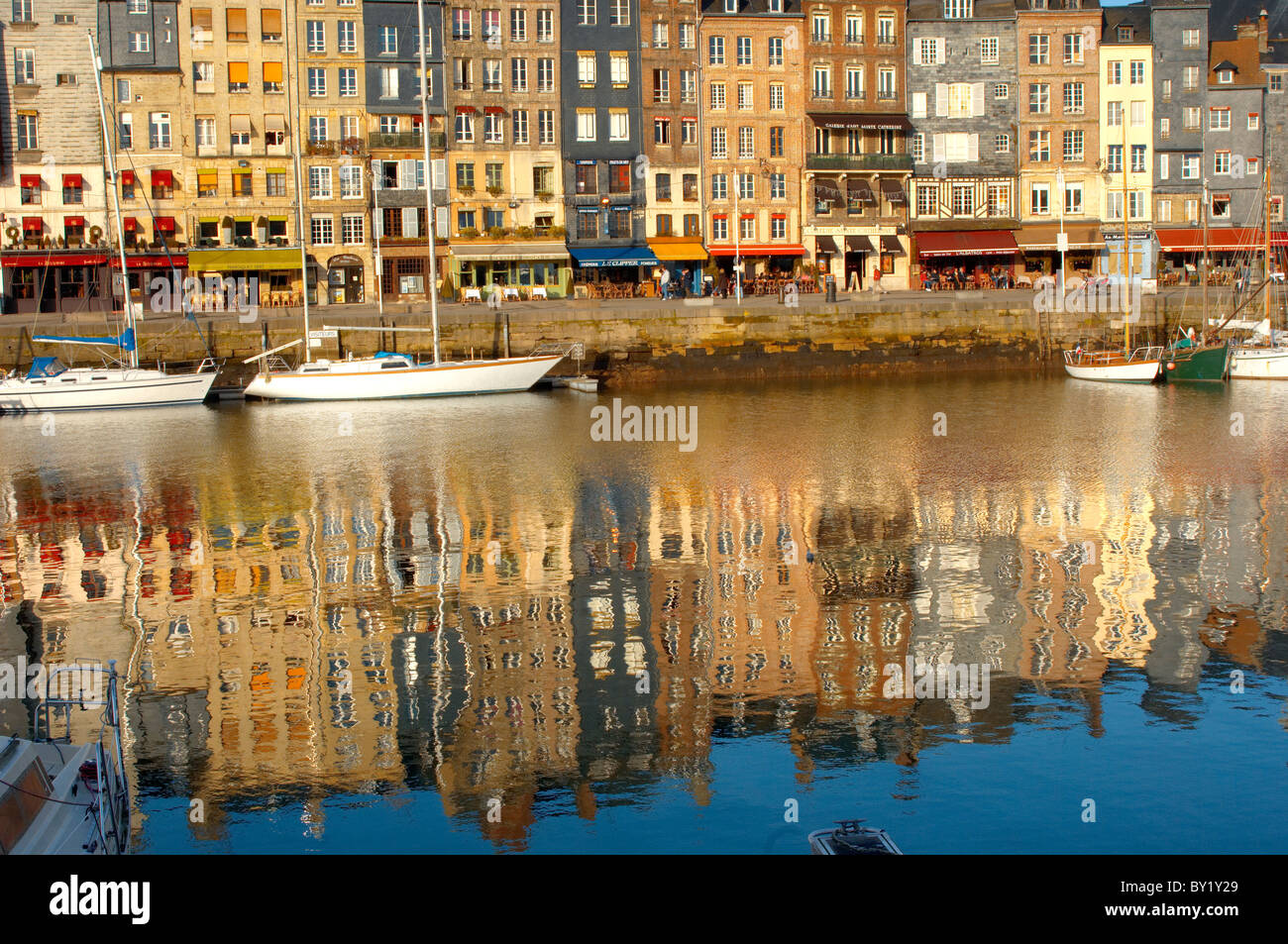 Reflection of harbour buildings and yaughts. Honfleur, Normandy, France ...