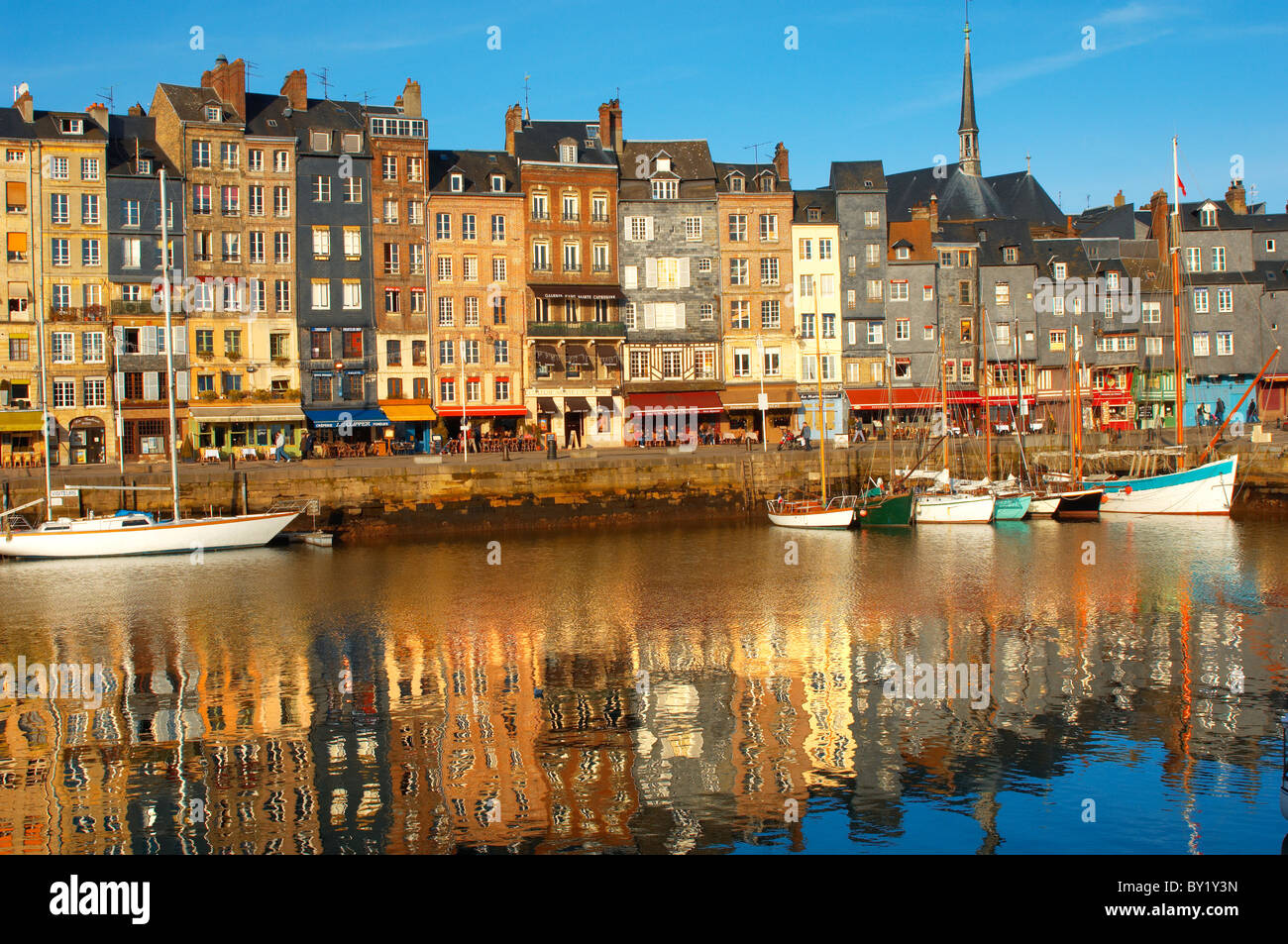 Reflection of harbour buildings and yaughts. Honfleur, Normandy, France ...