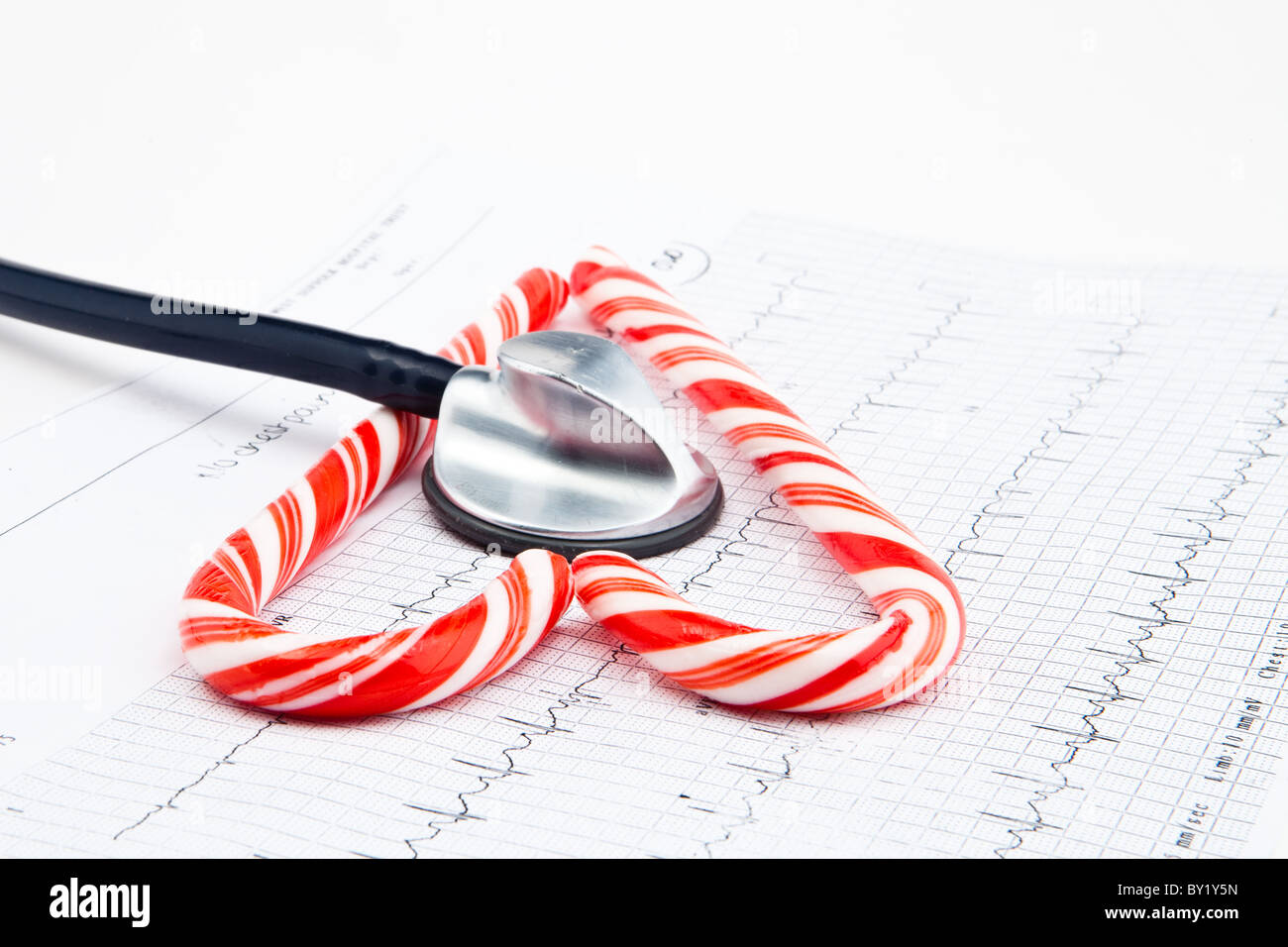 Candy came heart with a stethoscope on an ECG trace Stock Photo - Alamy