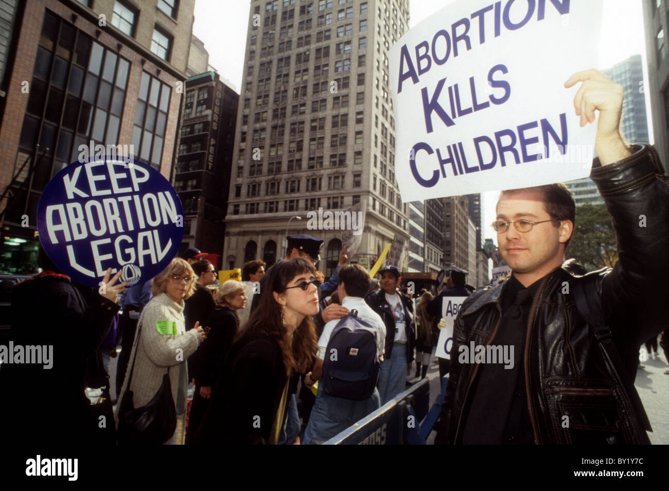 Pro-Choice demonstrators pass Pro-Life demonstrators at a protest in ...