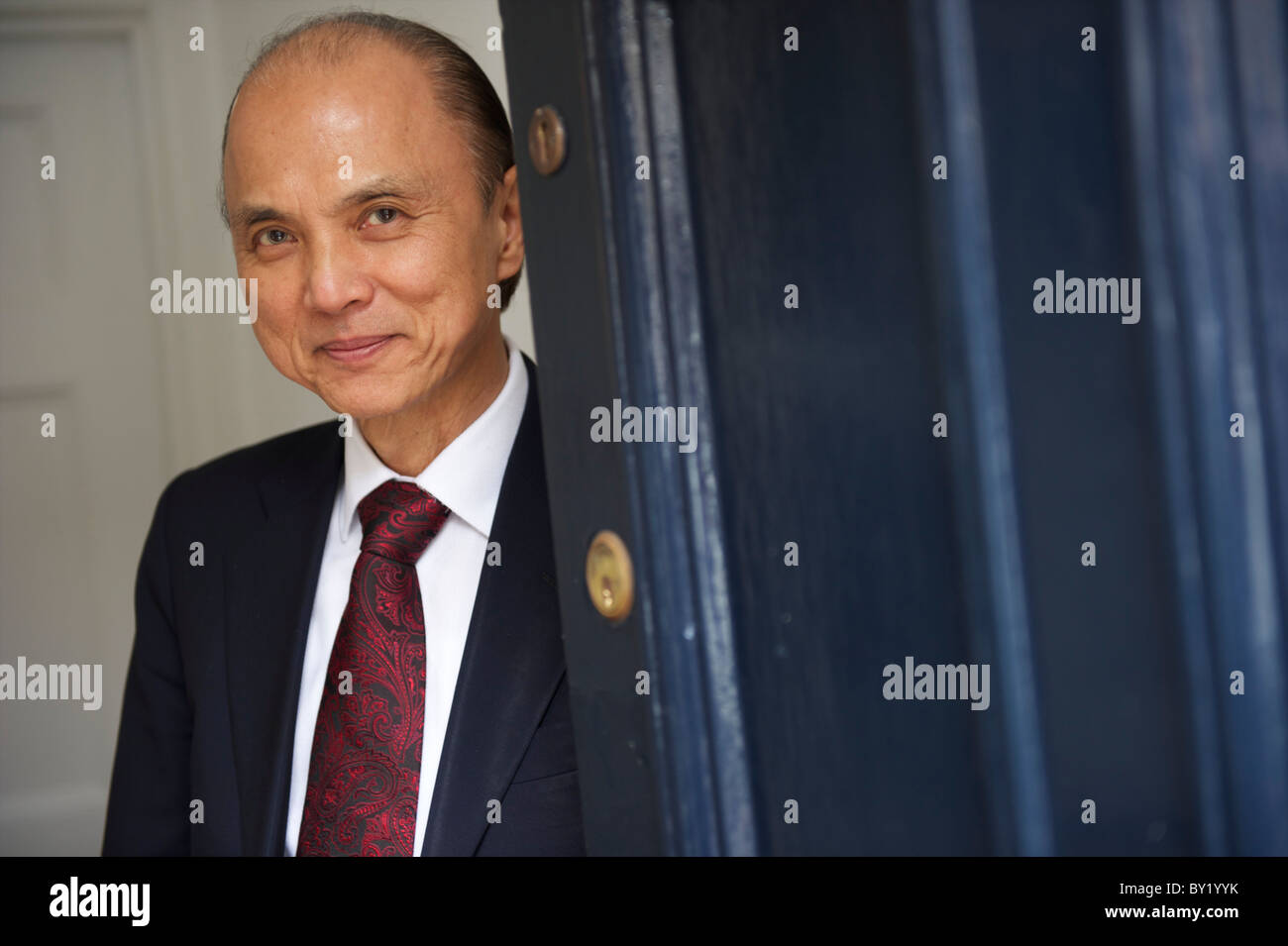 Fashion designer Jimmy Choo poses in his studio on Cannaught Street ...