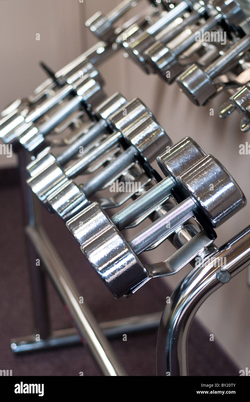 Dumbbell weights in a row Stock Photo - Alamy